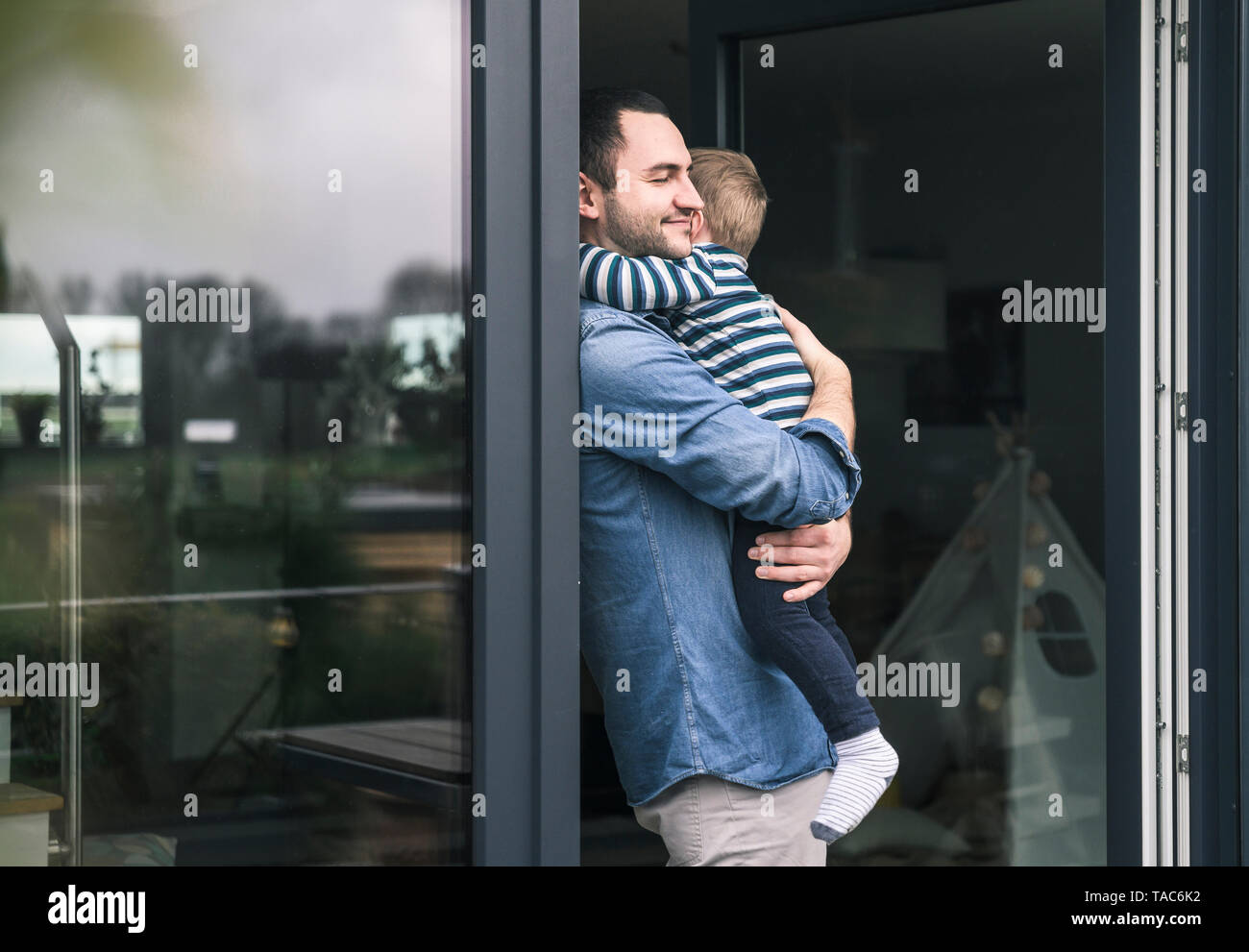 Man holding hugging case hi-res stock photography and images - Alamy