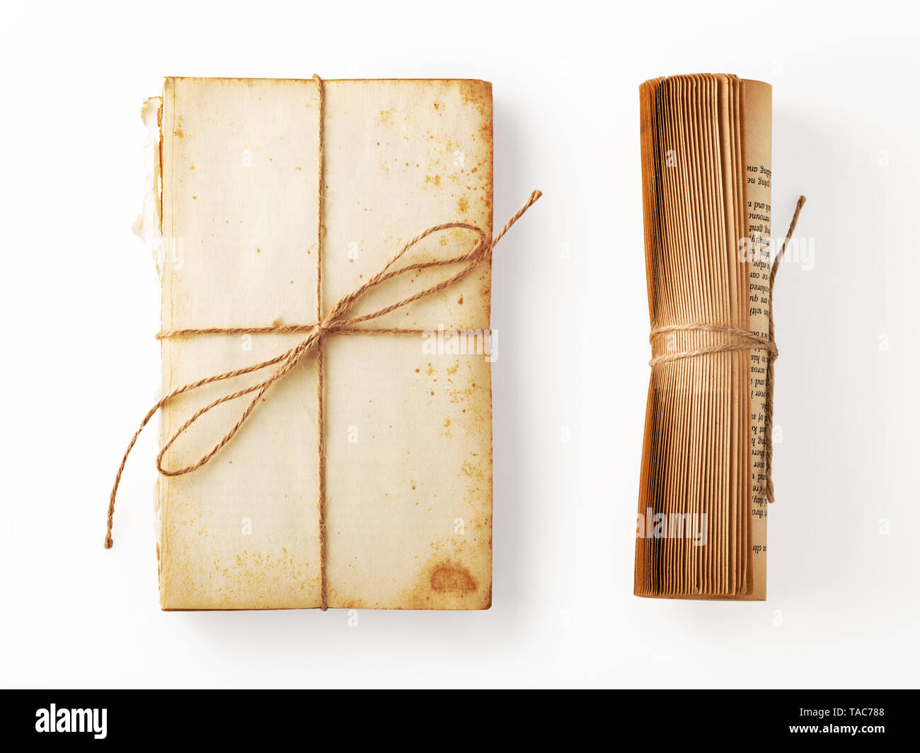 Old book paper and old book roll with brown string on white background ...