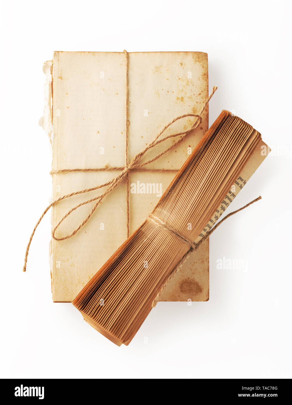 Viintage book paper roll on ripped old book with brown string tied on ...