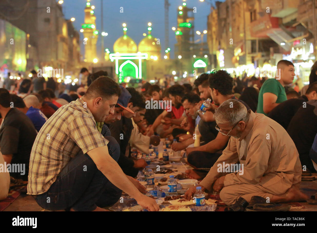 Baghdad, Iraq. 23rd May, 2019. People gather for a free public Iftar ...