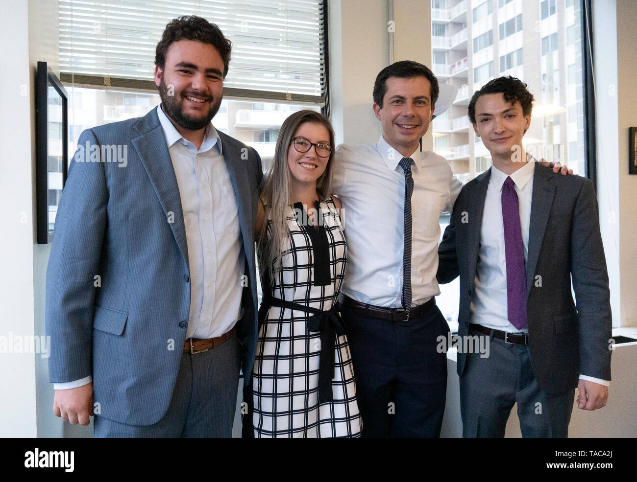Mayor Pete Buttigieg takes a photo with Harry Applestein, Rebekah ...