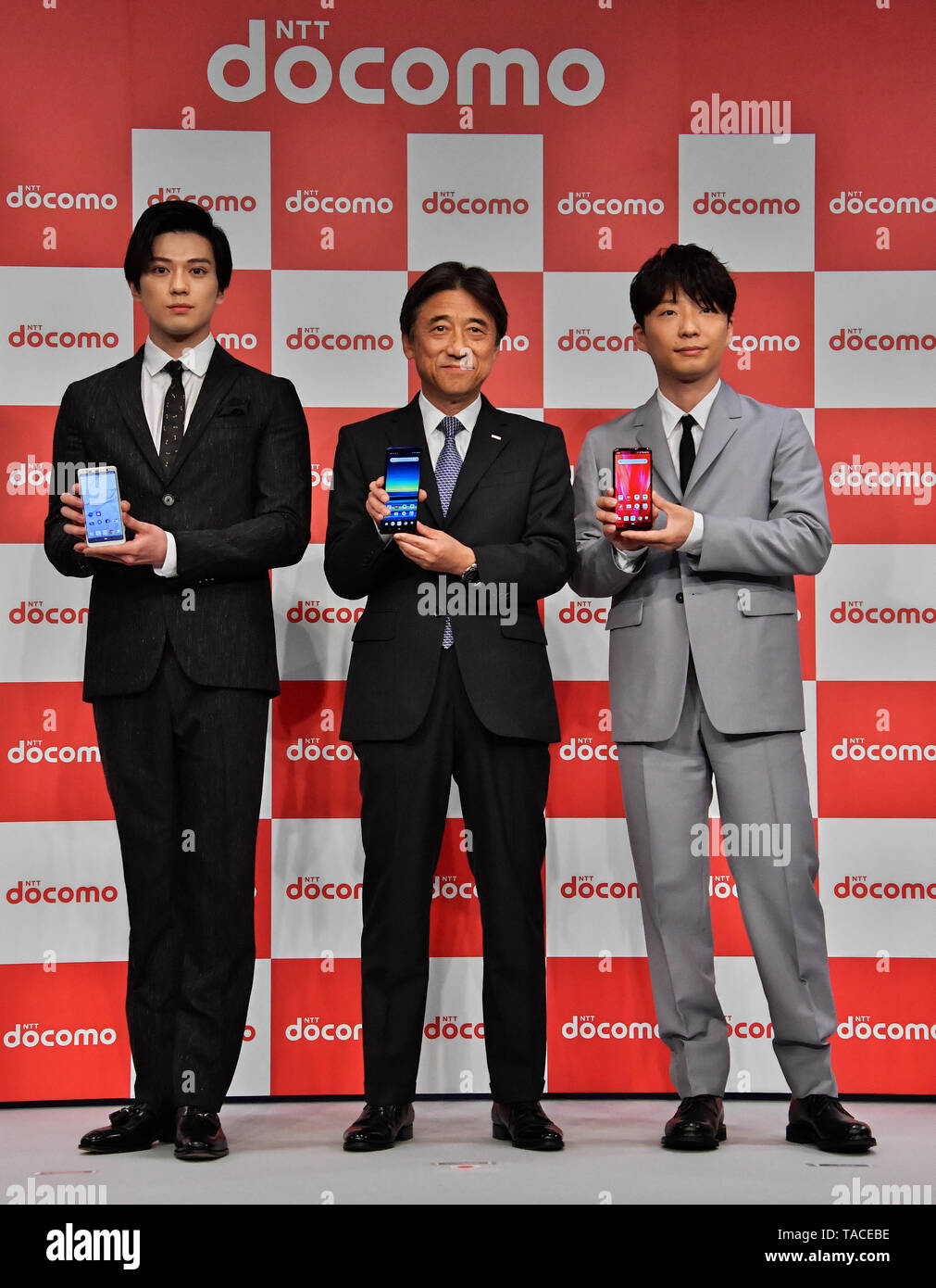 (L-R) Japanese actor Mackenyu Arata, President of NTT Docomo Kazuhiro ...