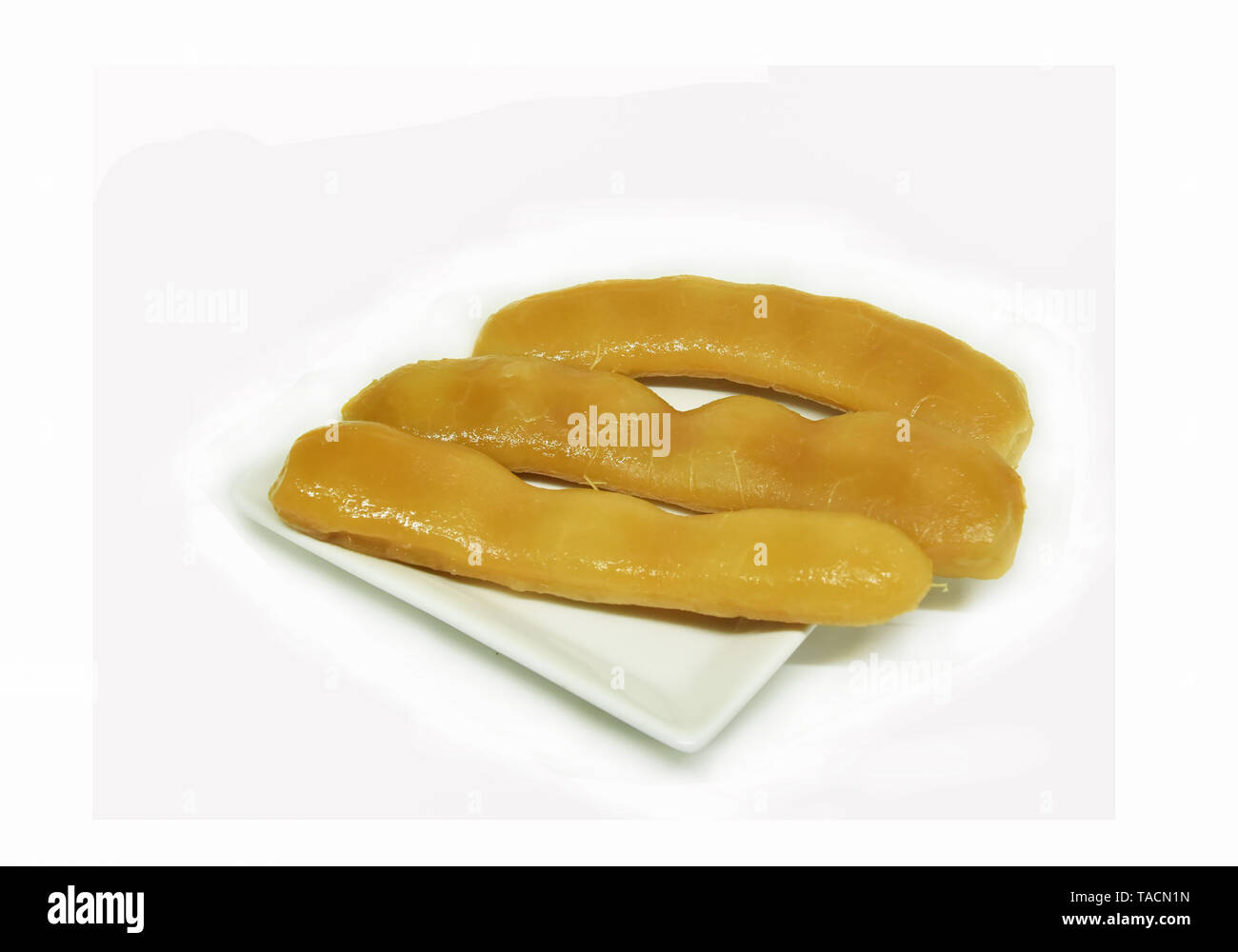 preserved sweet tamarind fruit isolated / tropical fruit peeled ...