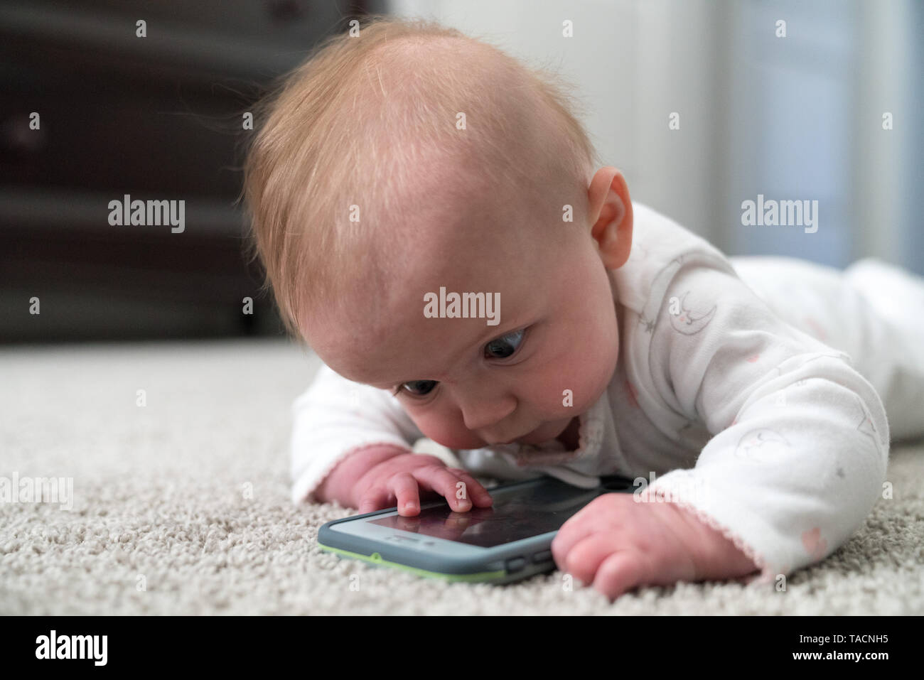 Child staring at phone screen hi-res stock photography and images - Alamy