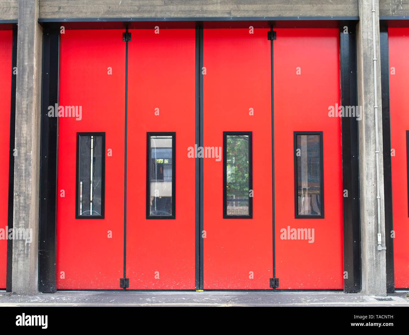 Red gates of a fire station in London Stock Photo - Alamy