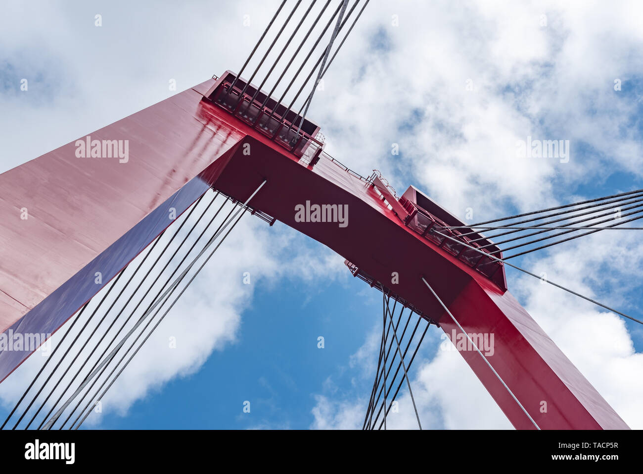 Willemsbrug bridge red cable bridge against blue sky and white clouds ...