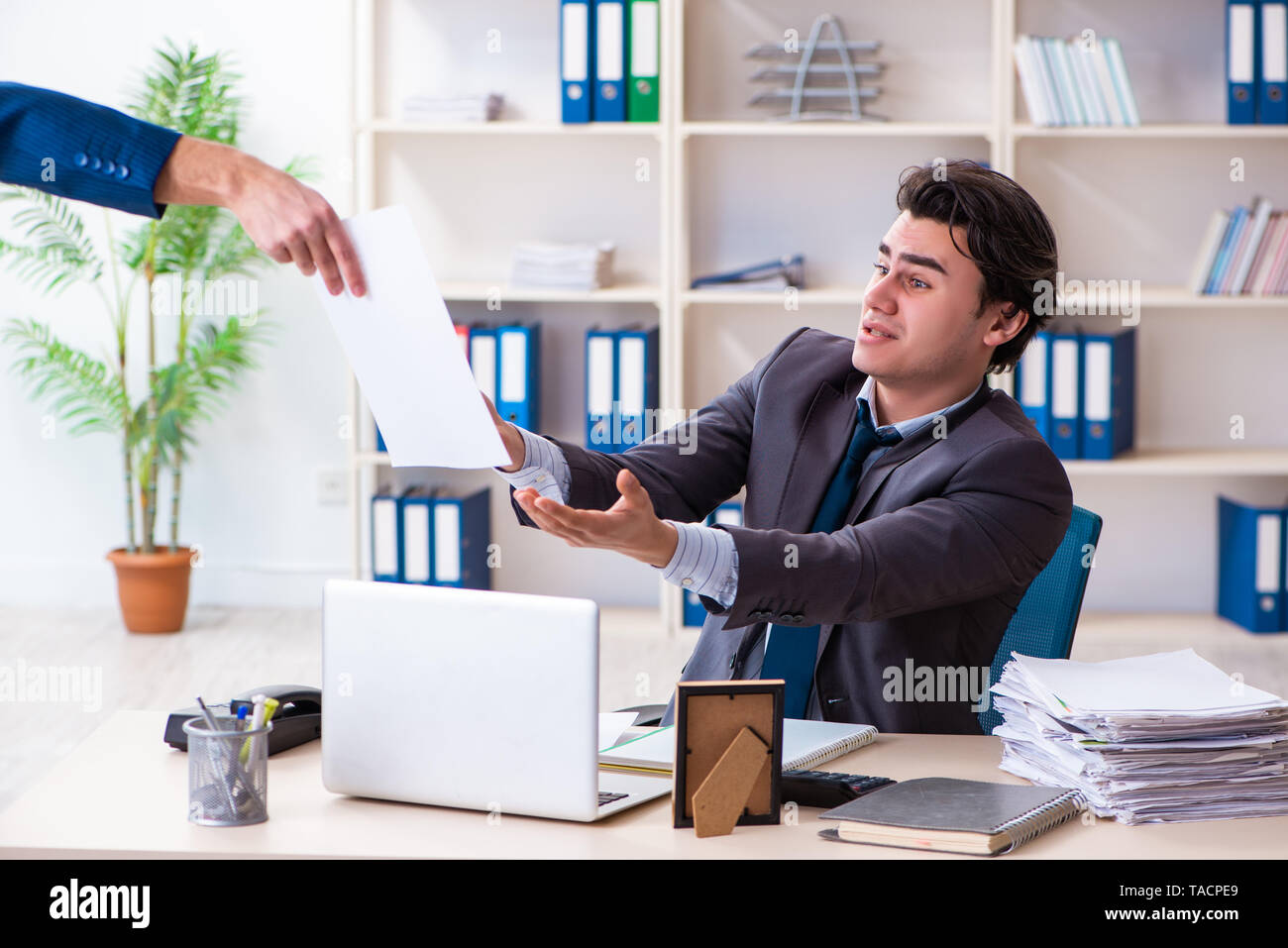 Young male employee being fired from his work Stock Photo - Alamy