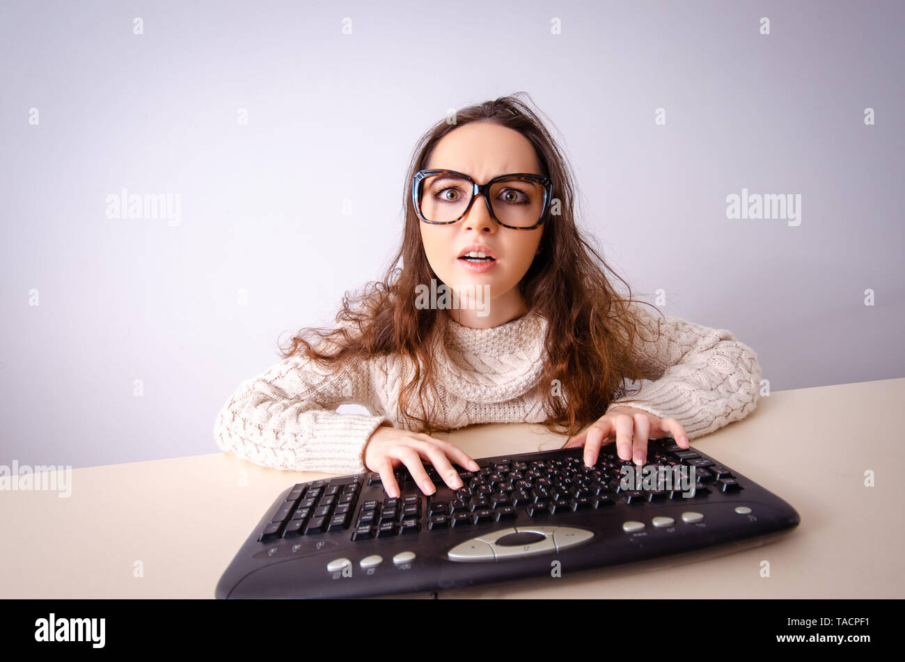 Funny nerd girl working on computer Stock Photo - Alamy