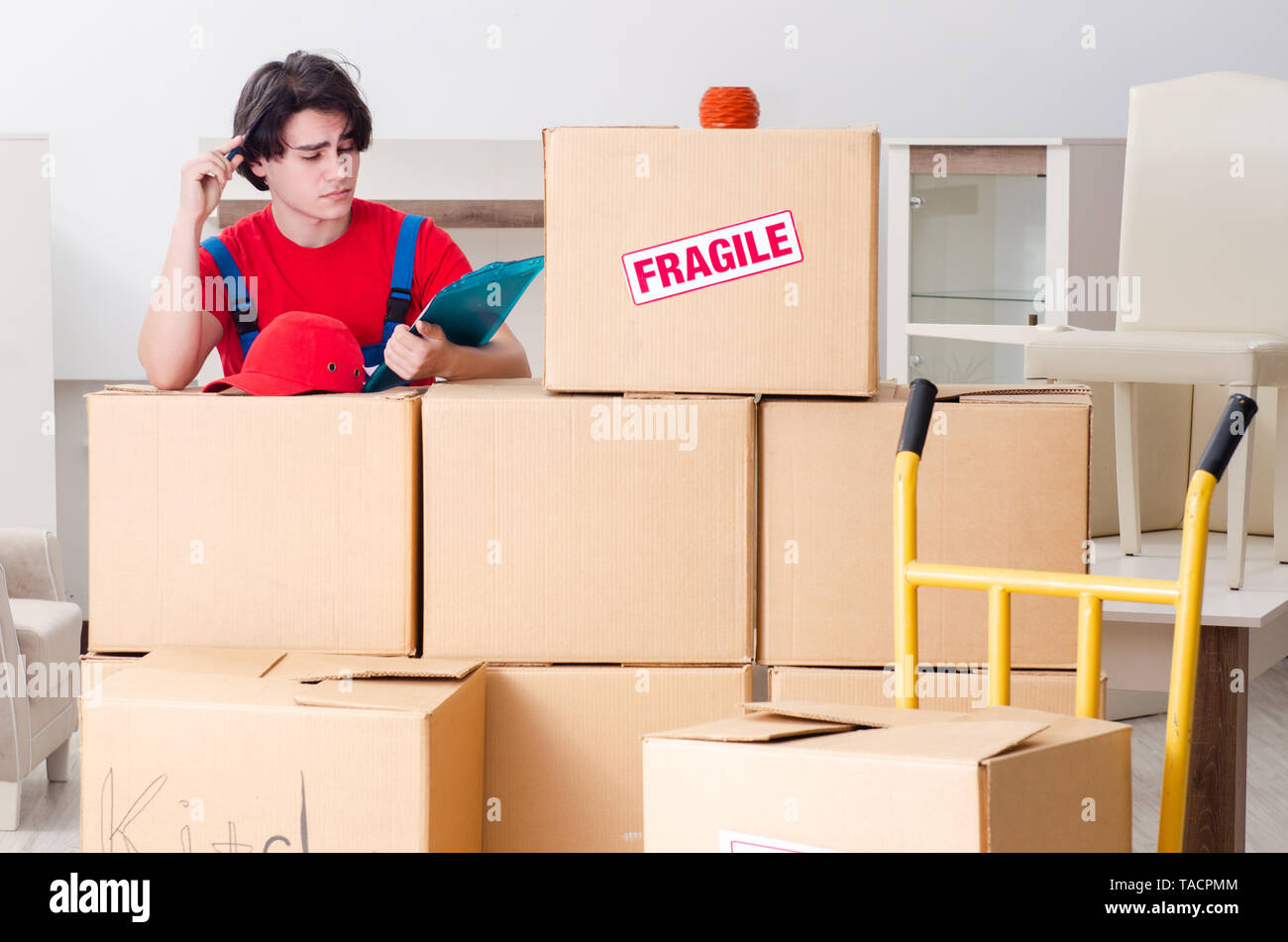 Young contractor boxes working hi-res stock photography and images - Alamy