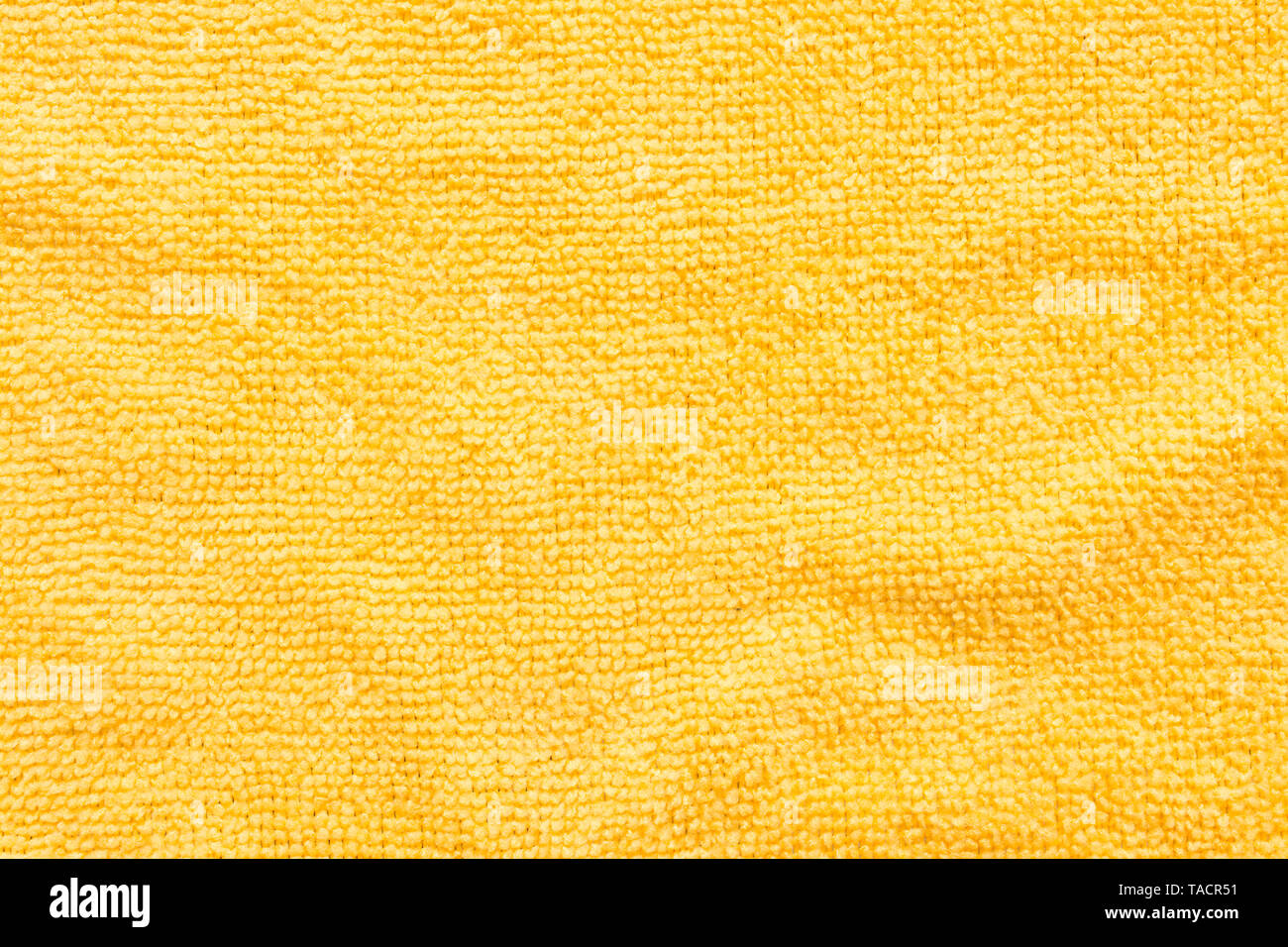 Surface of yellow microfiber cloth, macro textile pattern background ...