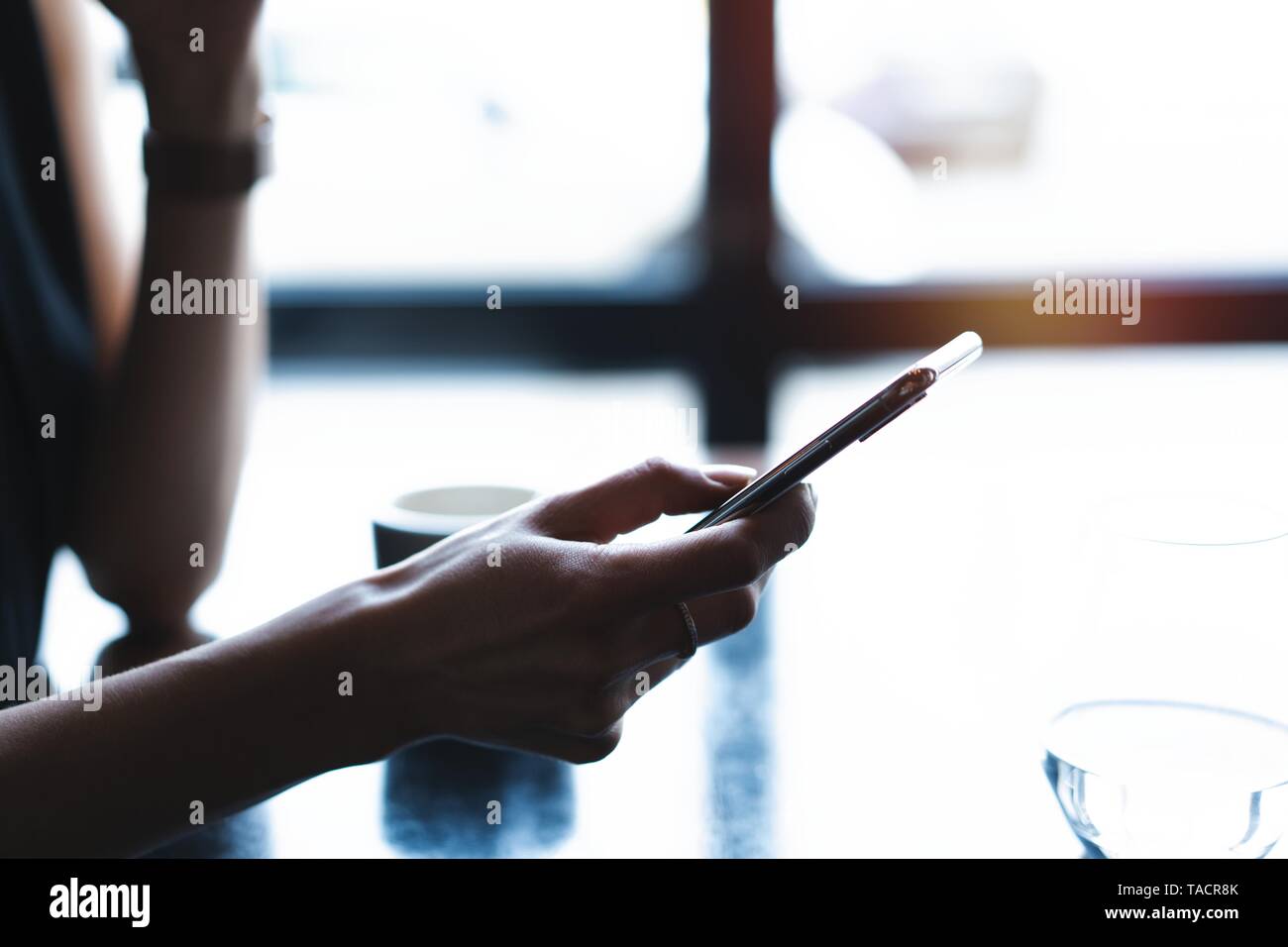 Close up of women's hands holding smartphone, female using mobile phone ...