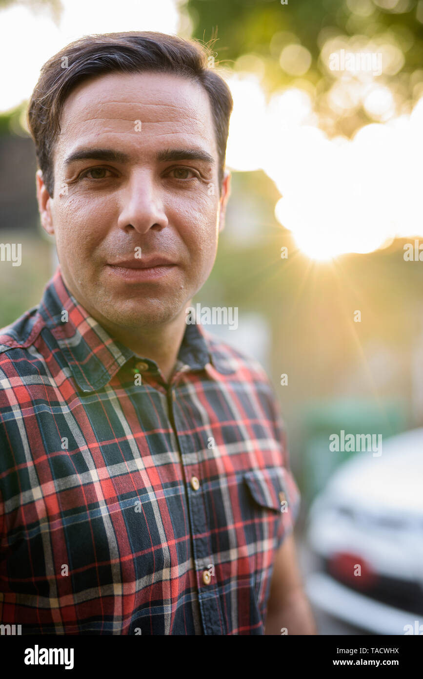 Portrait of handsome Persian man in the streets outdoors Stock Photo ...