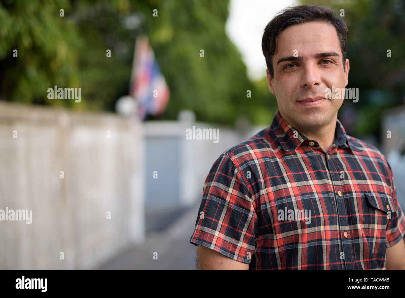 Portrait of handsome Persian man in the streets outdoors Stock Photo ...