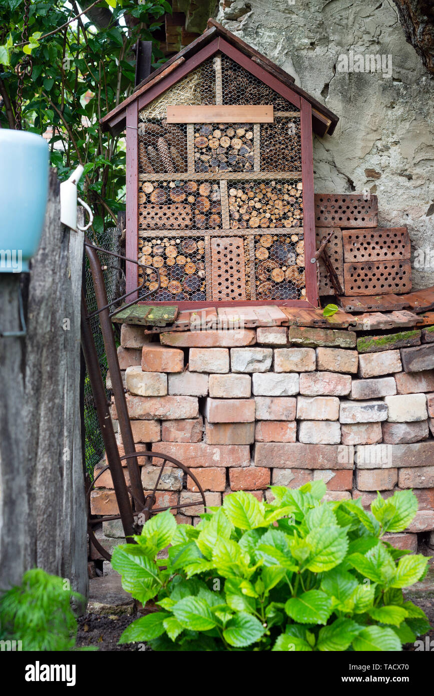 A nice wooden bug house in the garden Stock Photo - Alamy