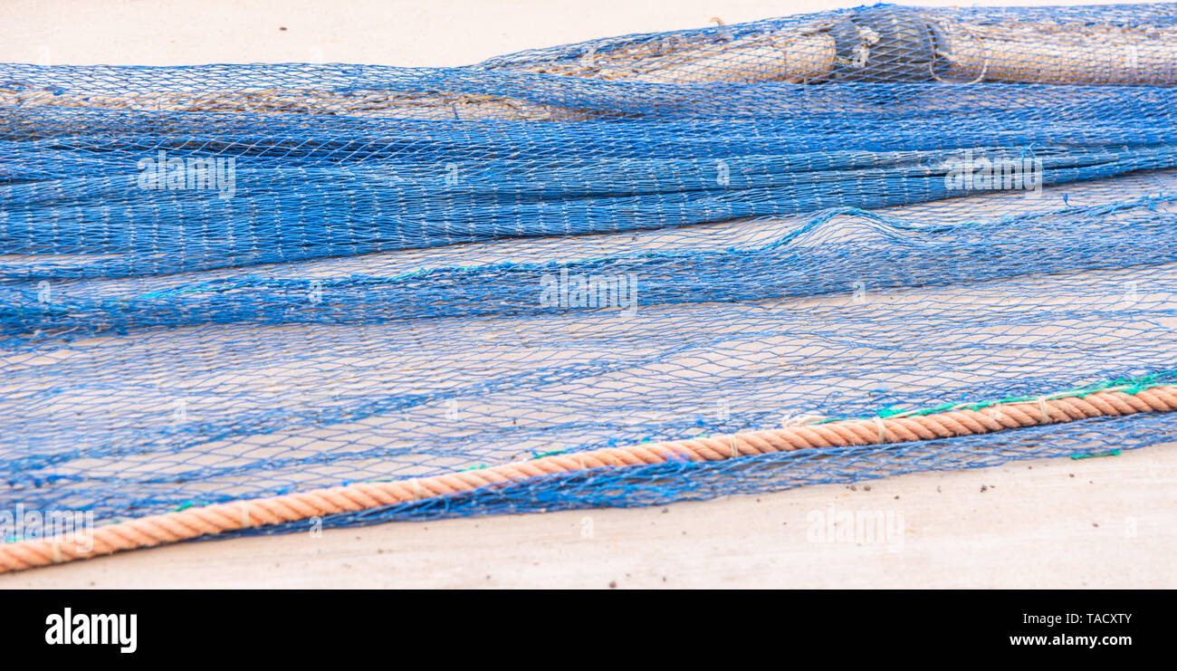 Industrial Fishing Equipment Fishnets and Fishing Lines lying on ...