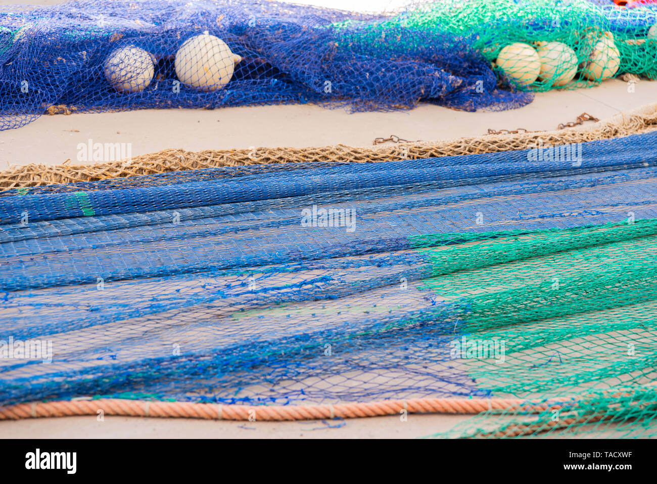 Industrial Fishing Equipment Fishnets and Fishing Lines lying on ...