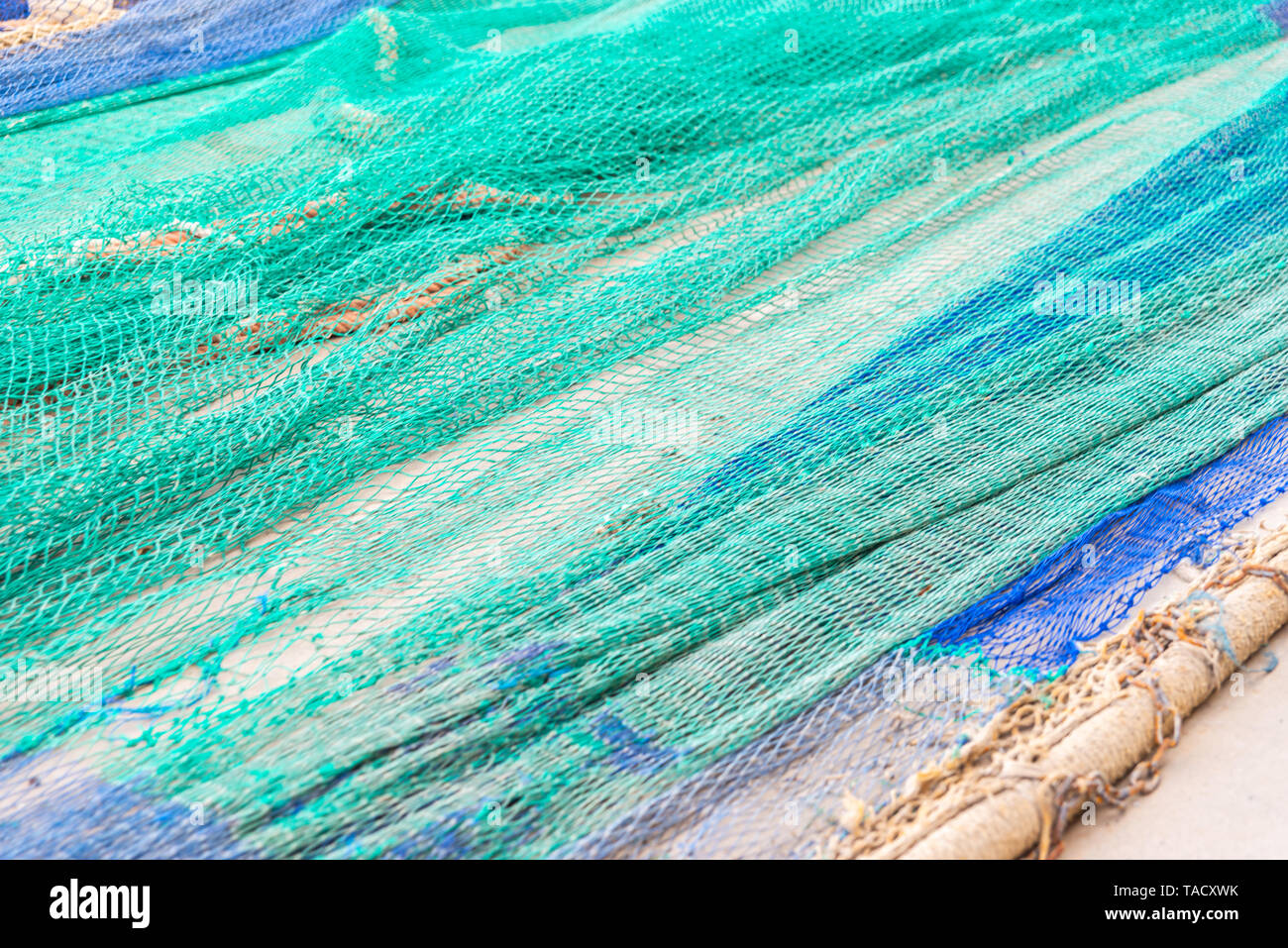 Industrial Fishing Equipment Fishnets and Fishing Lines lying on ...