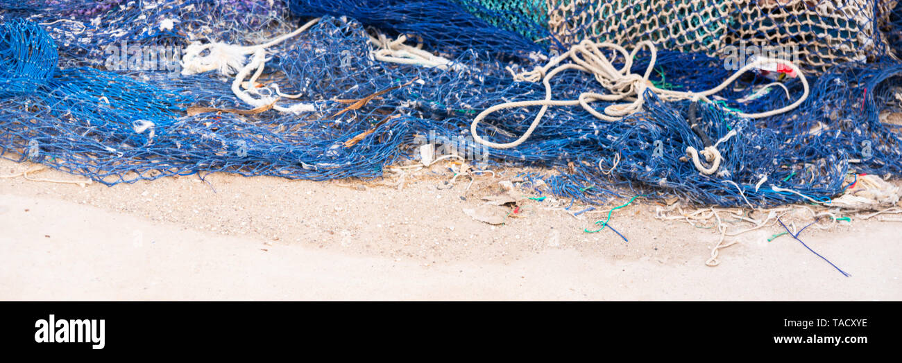 Industrial Fishing Equipment Fishnets and Fishing Lines lying on ...