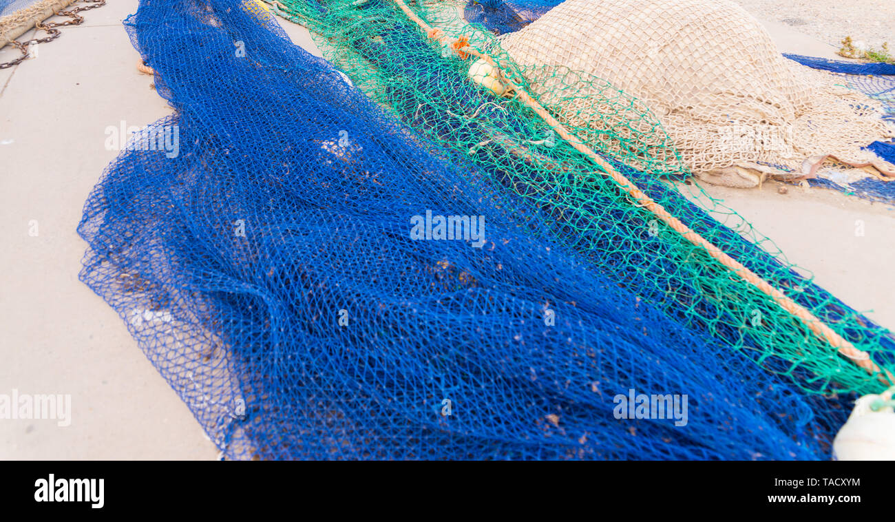 Industrial Fishing Equipment Fishnets and Fishing Lines lying on ...