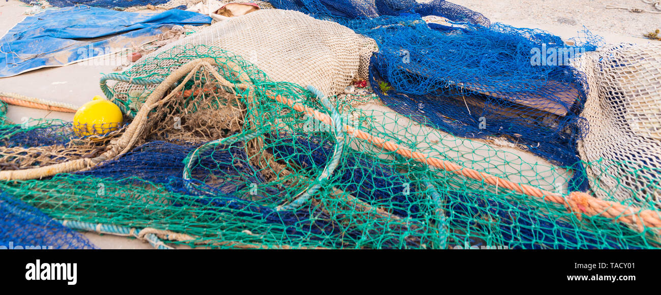 Industrial Fishing Equipment Fishnets and Fishing Lines lying on ...