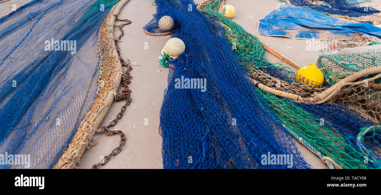 Industrial Fishing Equipment Fishnets and Fishing Lines lying on ...