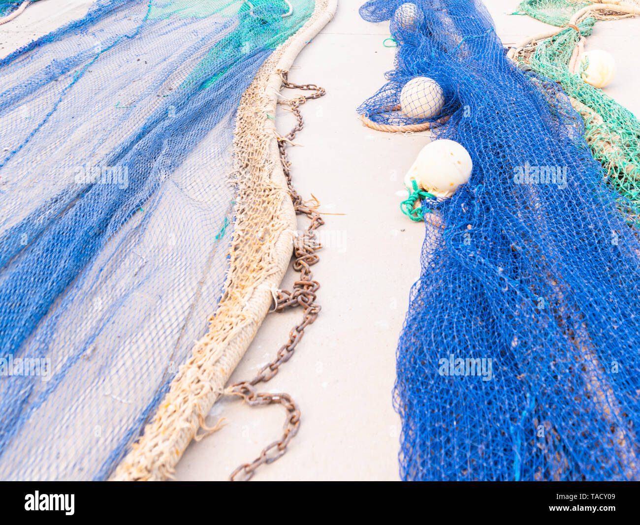 Industrial Fishing Equipment Fishnets and Fishing Lines lying on ...