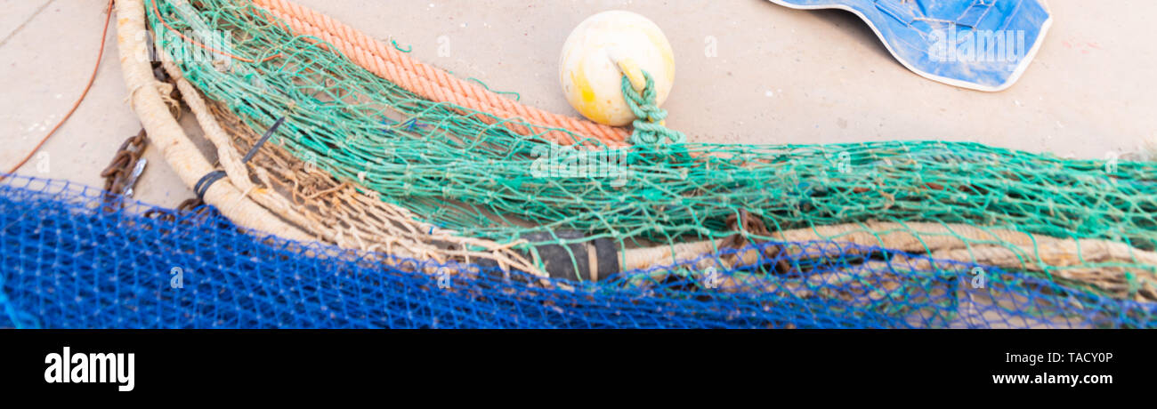 Industrial Fishing Equipment Fishnets and Fishing Lines lying on ...