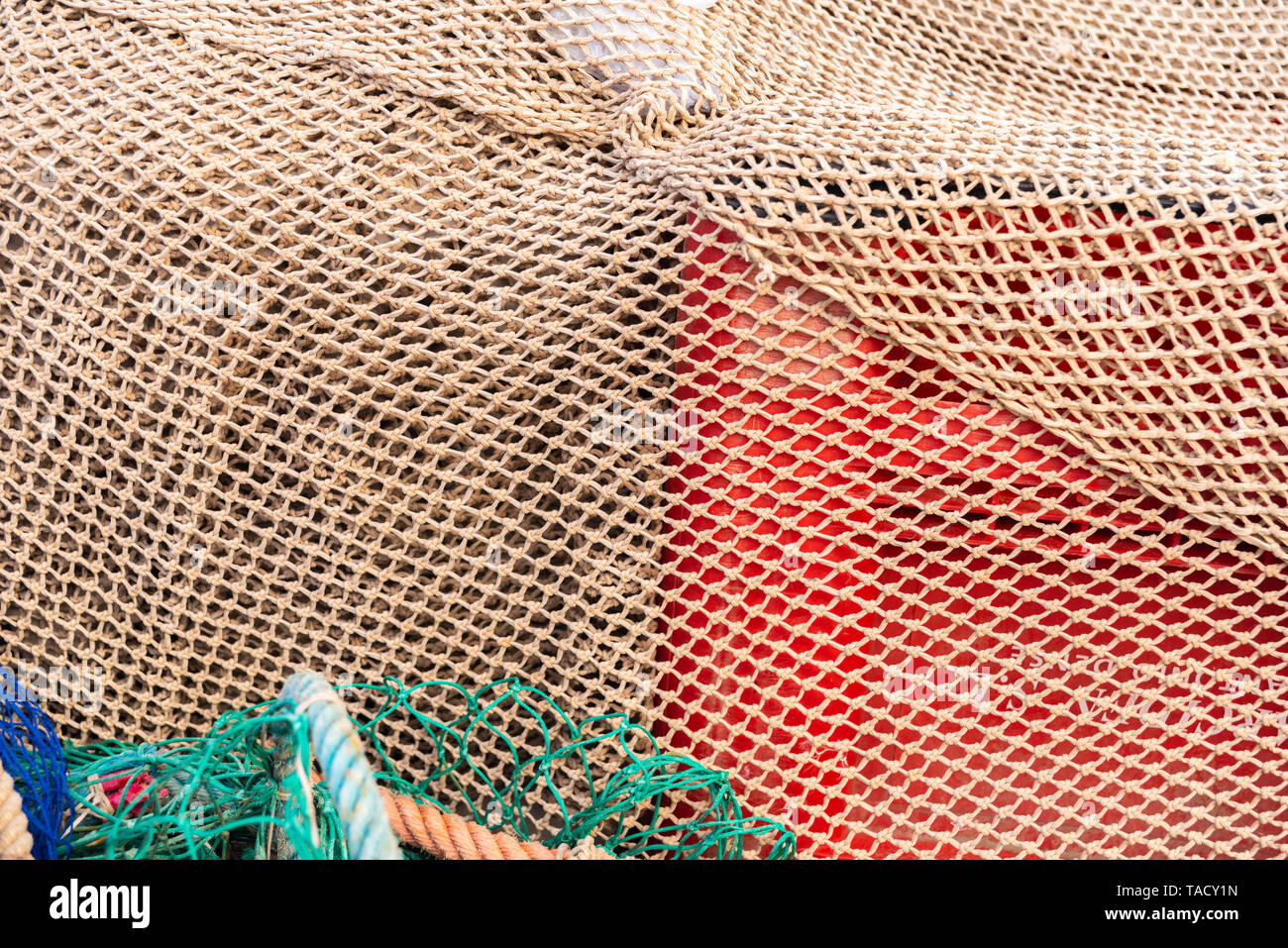 Industrial Fishing Equipment Fishnets and Fishing Lines lying on ...