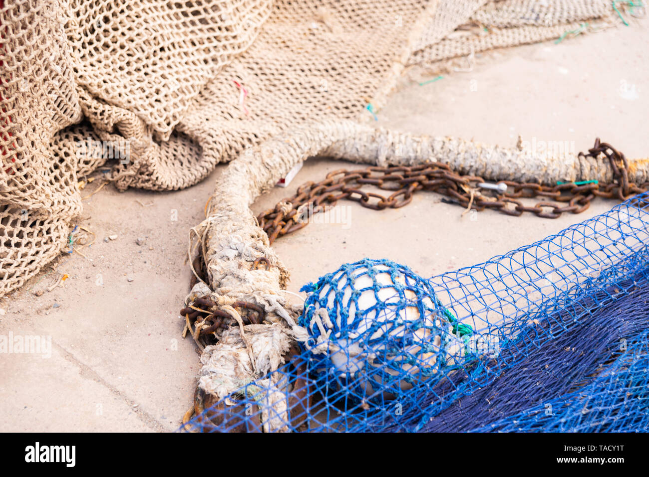 Industrial Fishing Equipment Fishnets and Fishing Lines lying on ...