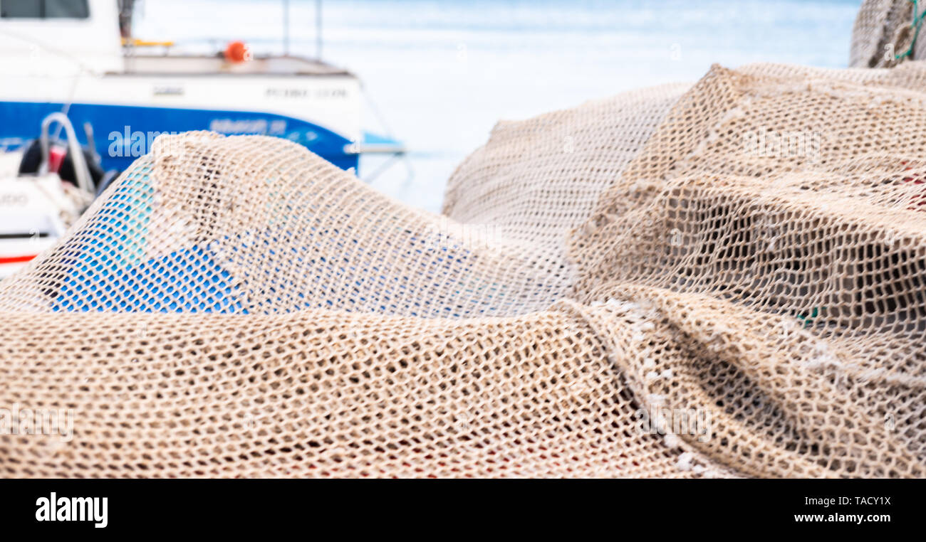 Industrial Fishing Equipment Fishnets and Fishing Lines lying on ...