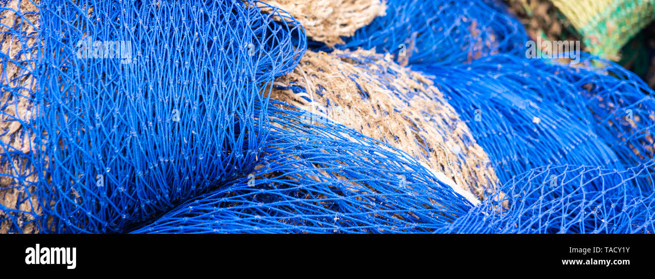 Industrial Fishing Equipment Fishnets and Fishing Lines lying on ...