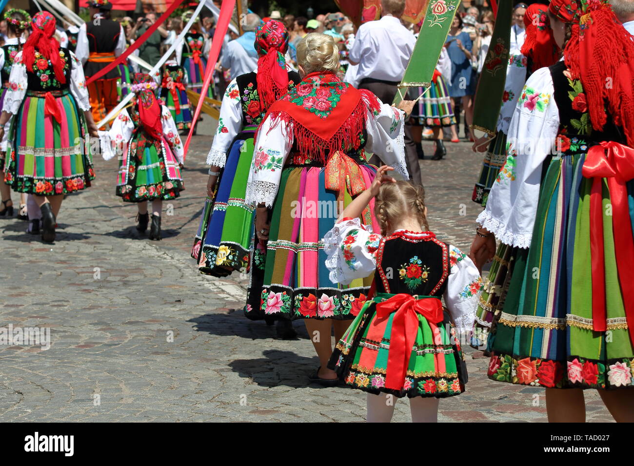 Local people from Lowicz in Poland wearing traditional colorful folk ...