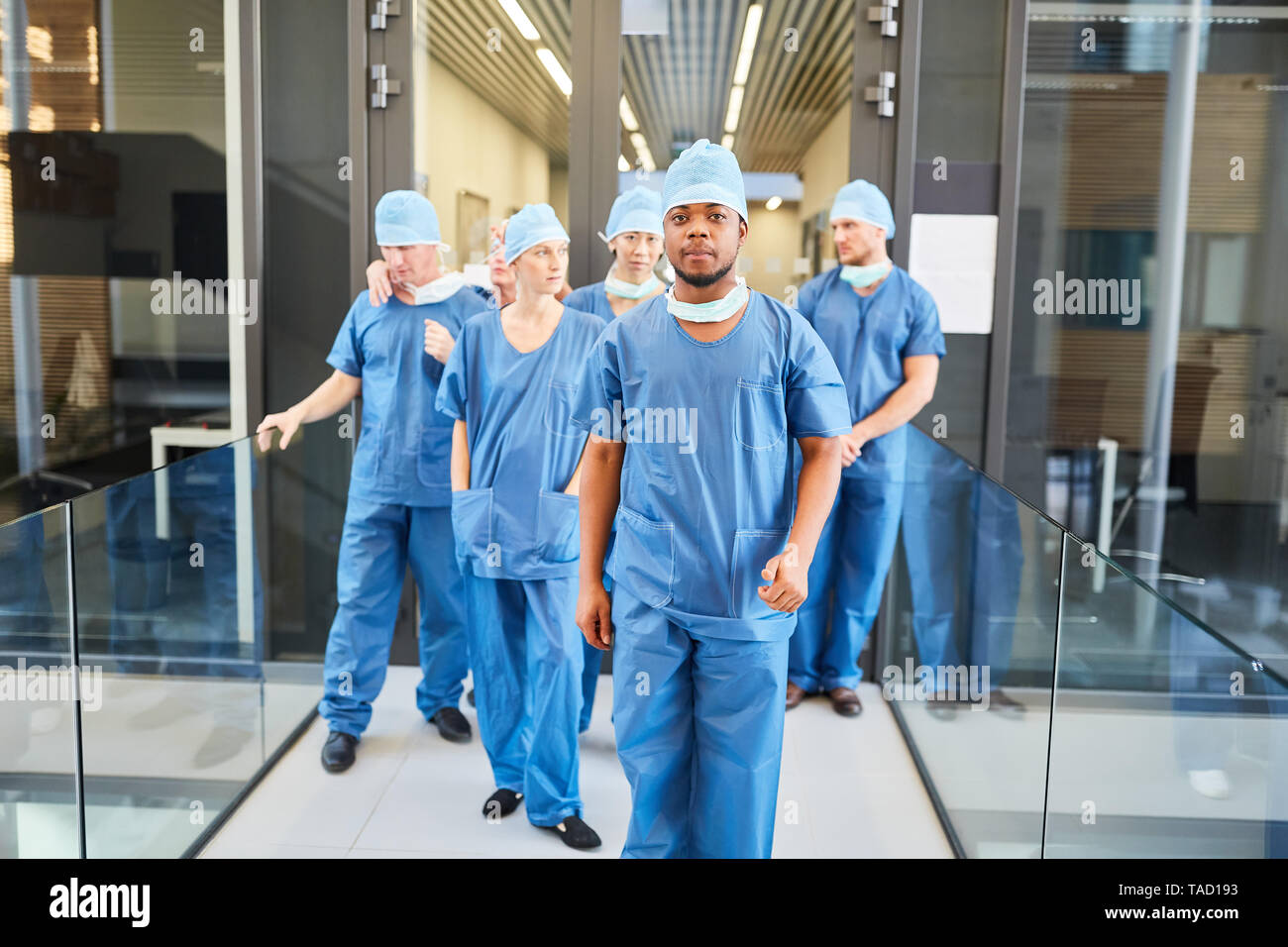 Group doctors as a surgery team in front of the emergency department of ...