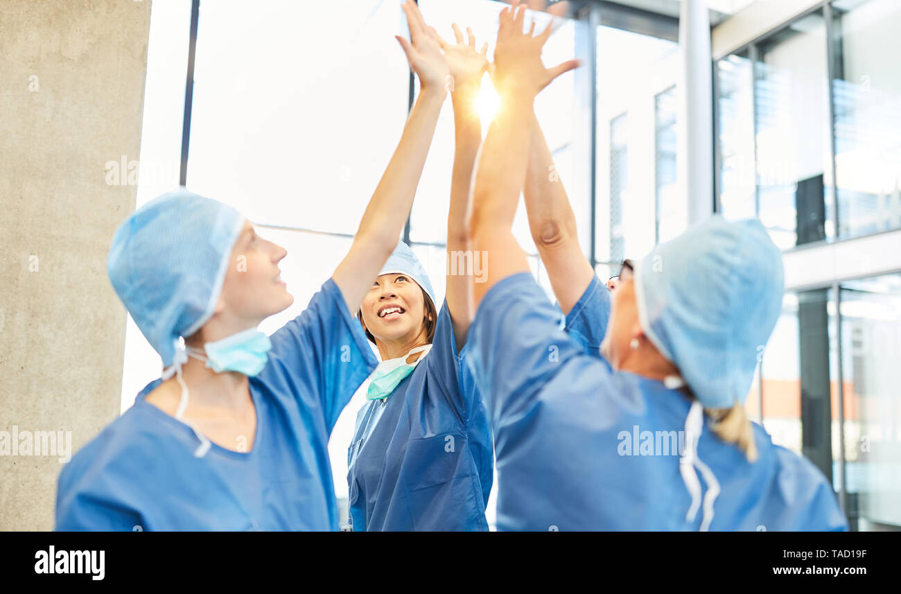 Doctors Team of Surgery gives High Five motivation in a clinic Stock ...