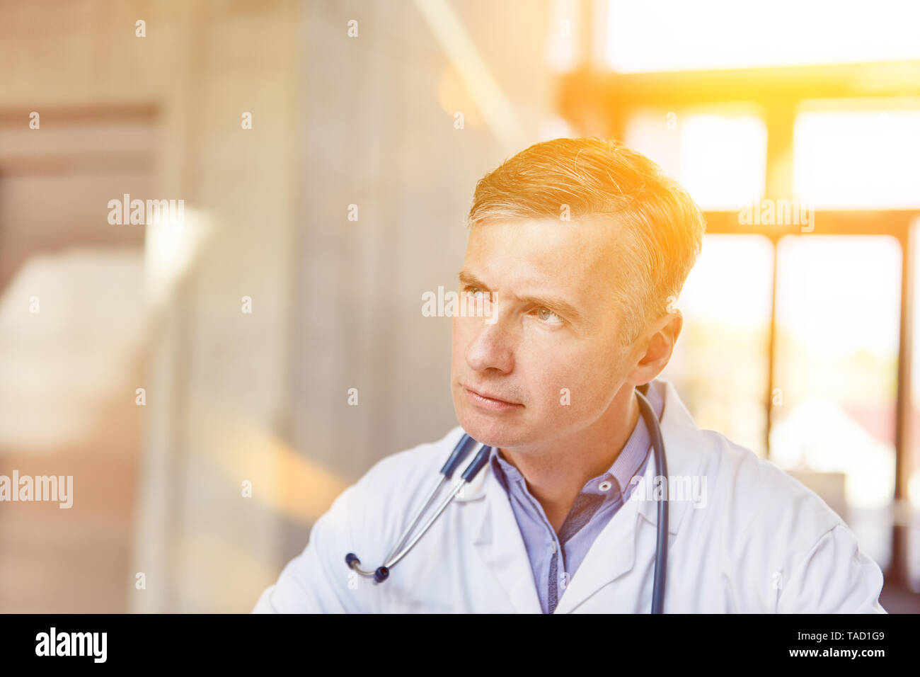 Chief doctor or senior physician while thinking in his office in a ...