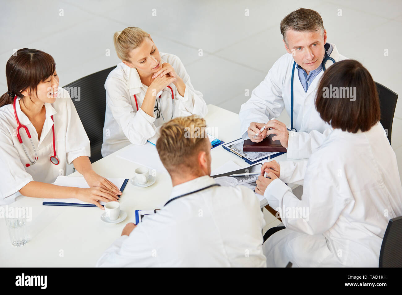 Doctors sit together at a team meeting in the doctor's office Stock ...