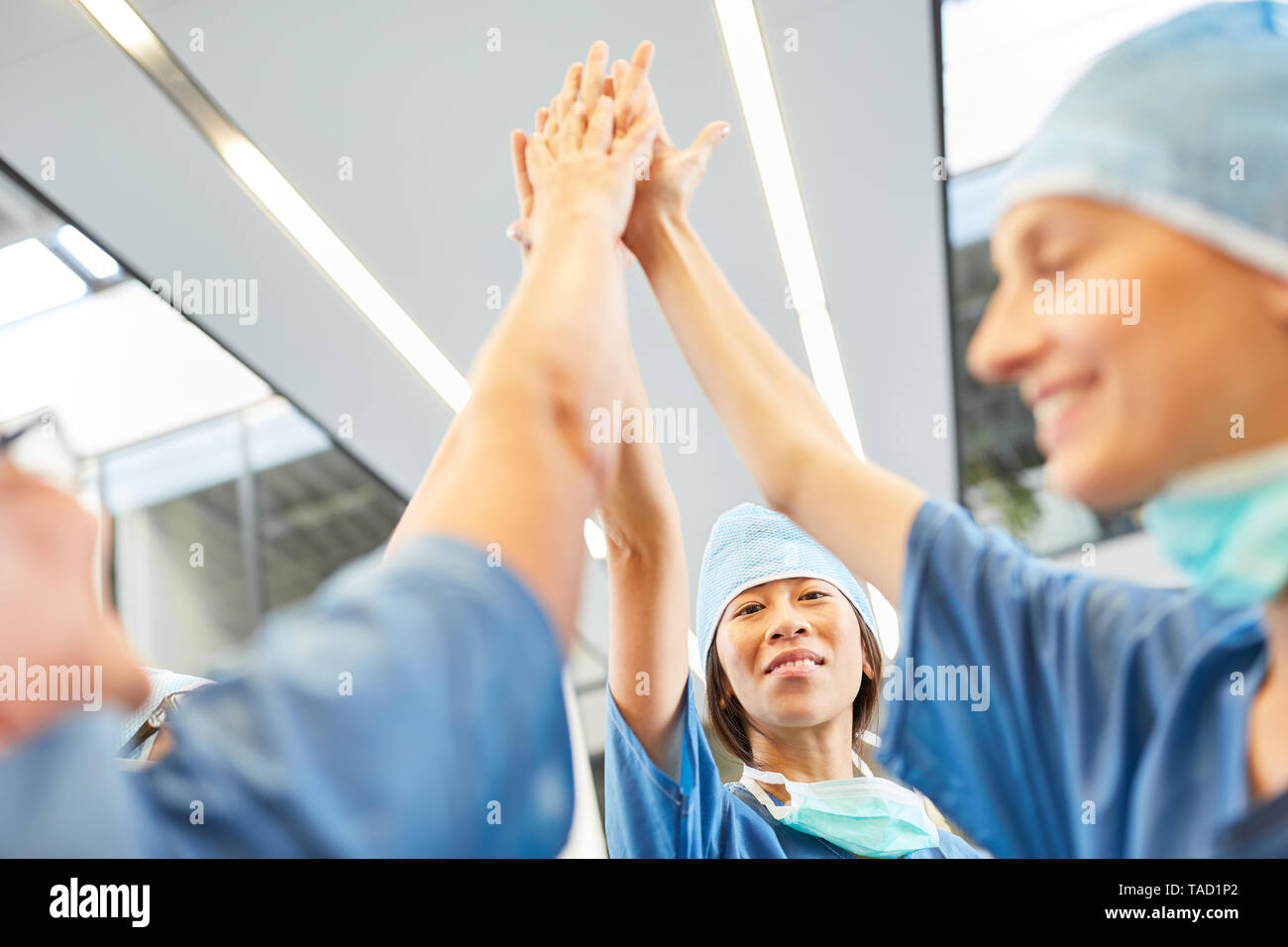 Doctors Team of Surgery gives high five after a successful operation ...