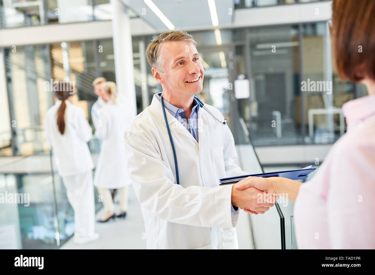 Doctor greets a patient with handshake as a greeting or thanks Stock ...