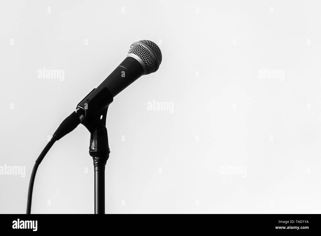 Black microphone with cable on white background, square photo Stock ...
