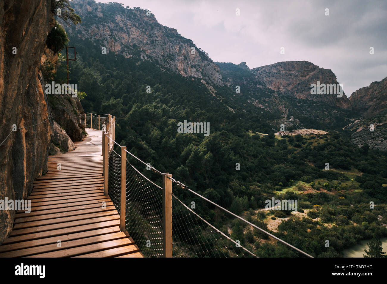 Wooden walkway among rock mountains in south of Spain and runway on the ...