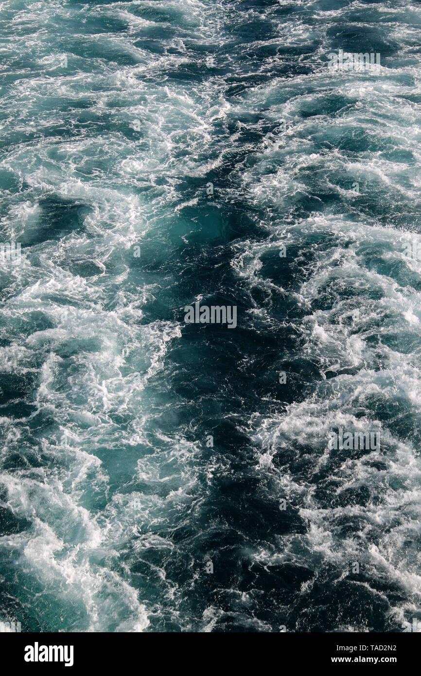 Water trail on the blue sea after big ship with two engines Stock Photo ...