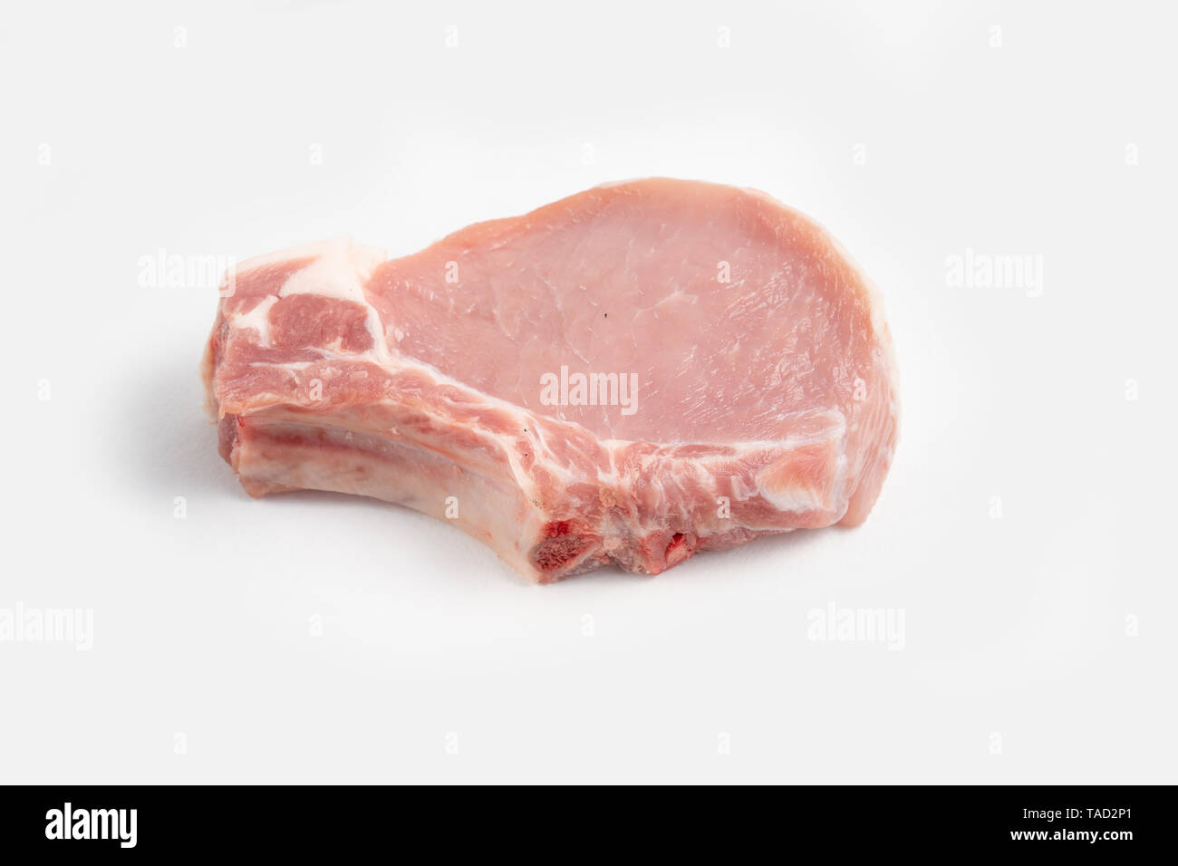 Raw pork meat isolated on white background with clipping path One slice ...
