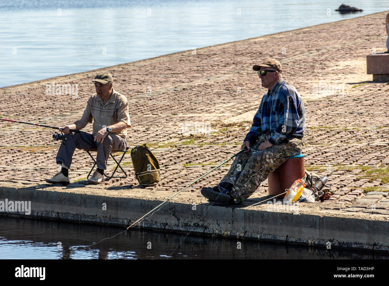 Russia, Petrozavodsk, 24 may 2018, Two fishermen catch fish on the ...