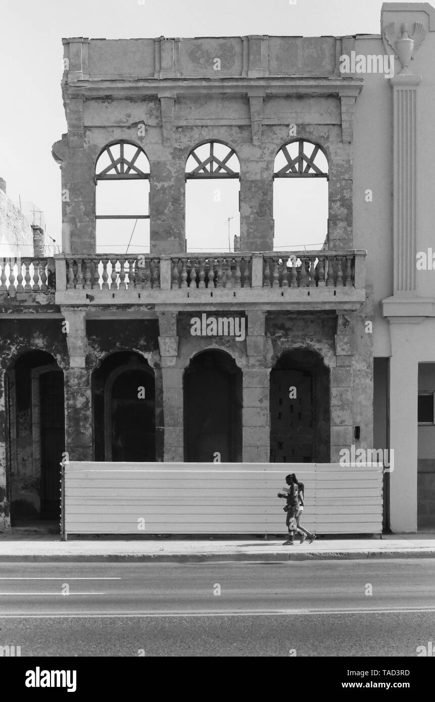 Old, and often derelict, buildings front the Malecón, next to the ...