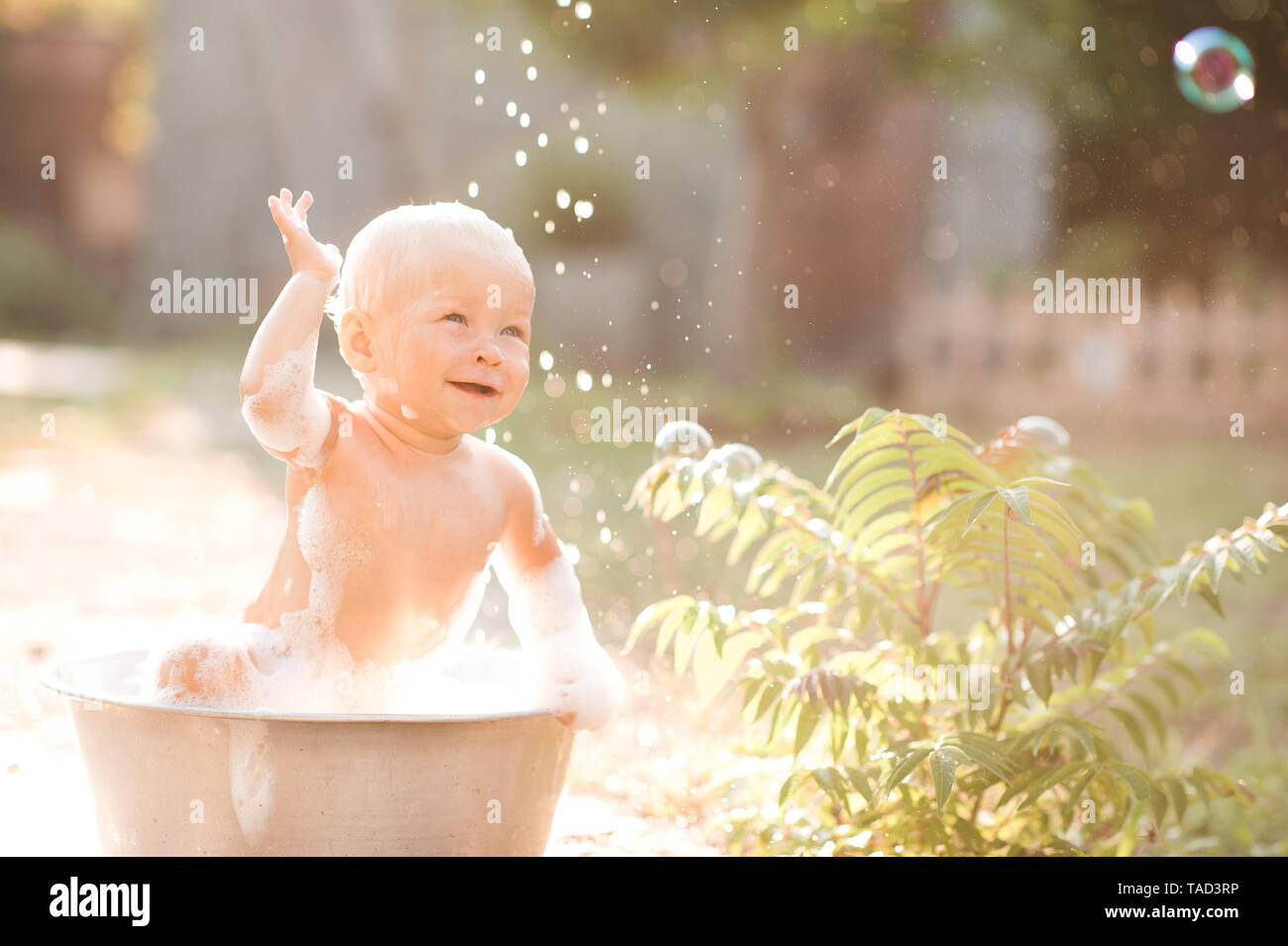 Happy baby taking bath playing hi-res stock photography and images - Alamy