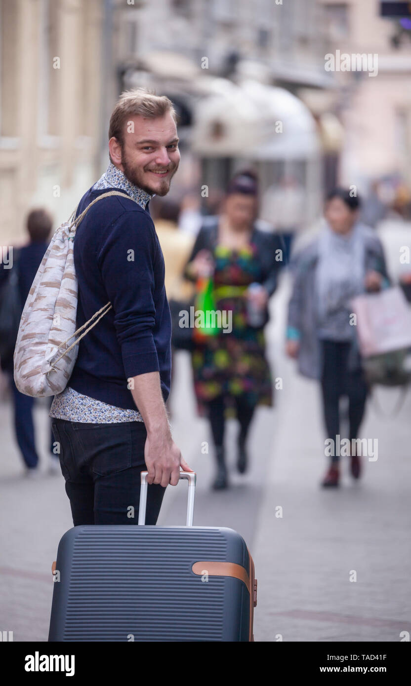 One young man - traveler or tourist, turned back and looking back to a ...