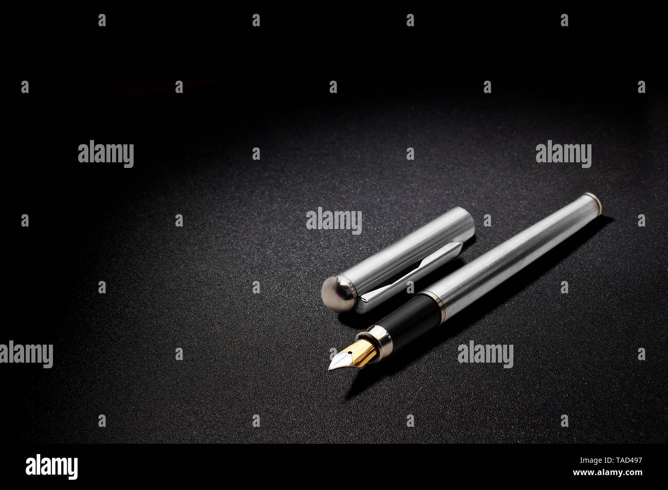 antique fountain pen on black background Stock Photo - Alamy