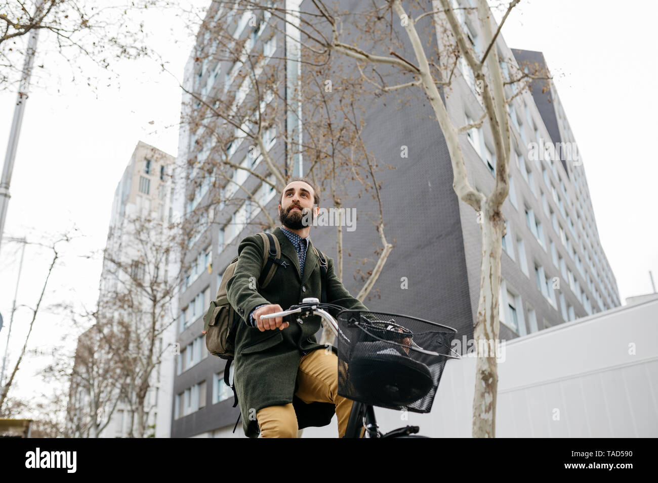 Man riding e-bike in the city Stock Photo - Alamy