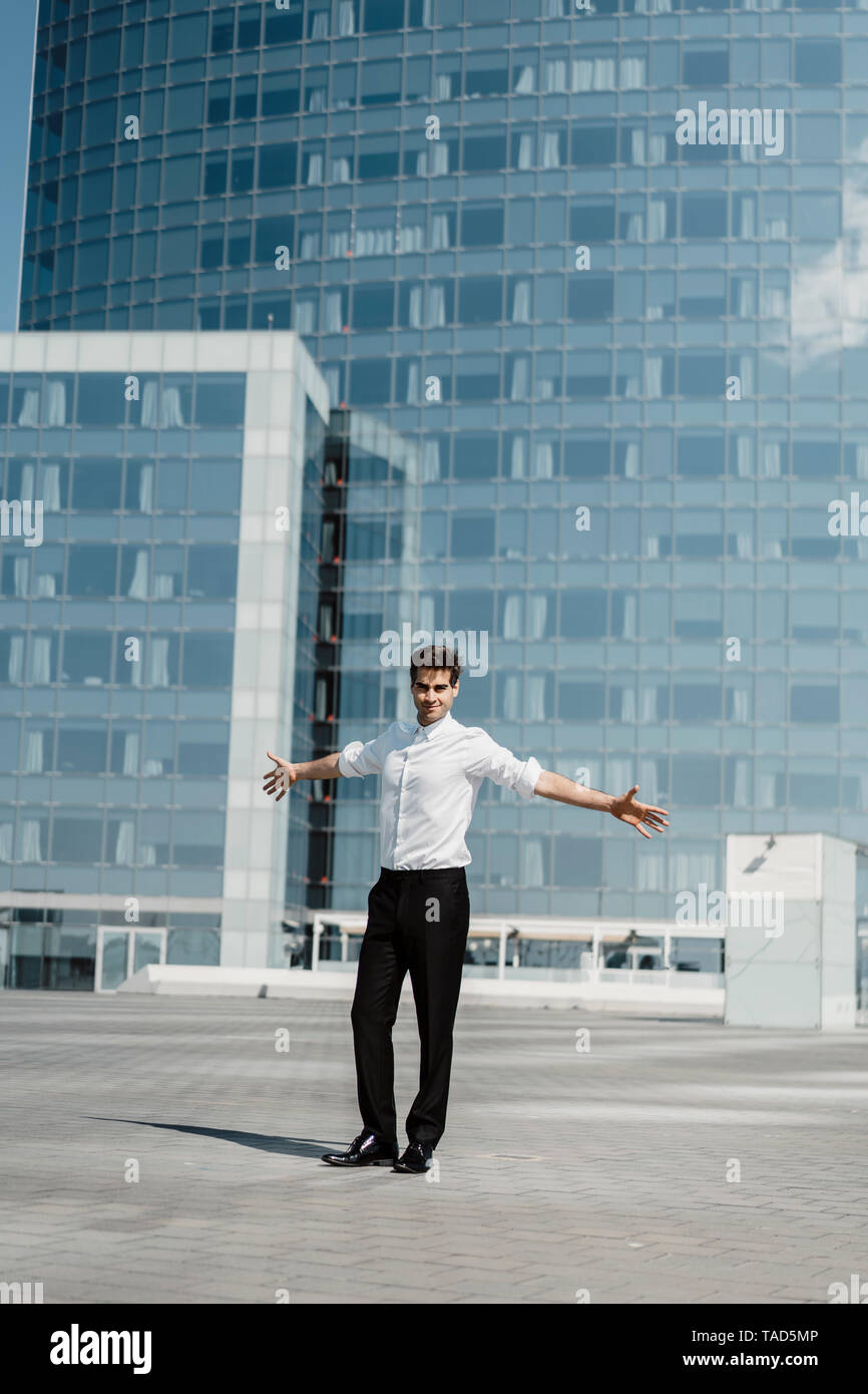 Portrait of smart man standing on roof terrace hi-res stock photography ...