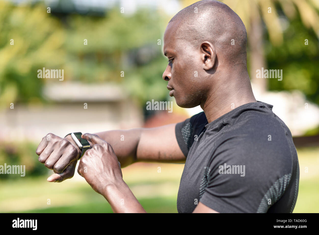 Runner checking smart watch fitness tracker hi-res stock photography ...